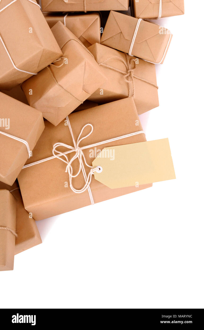 Untidy pile of brown parcels with label Stock Photo - Alamy