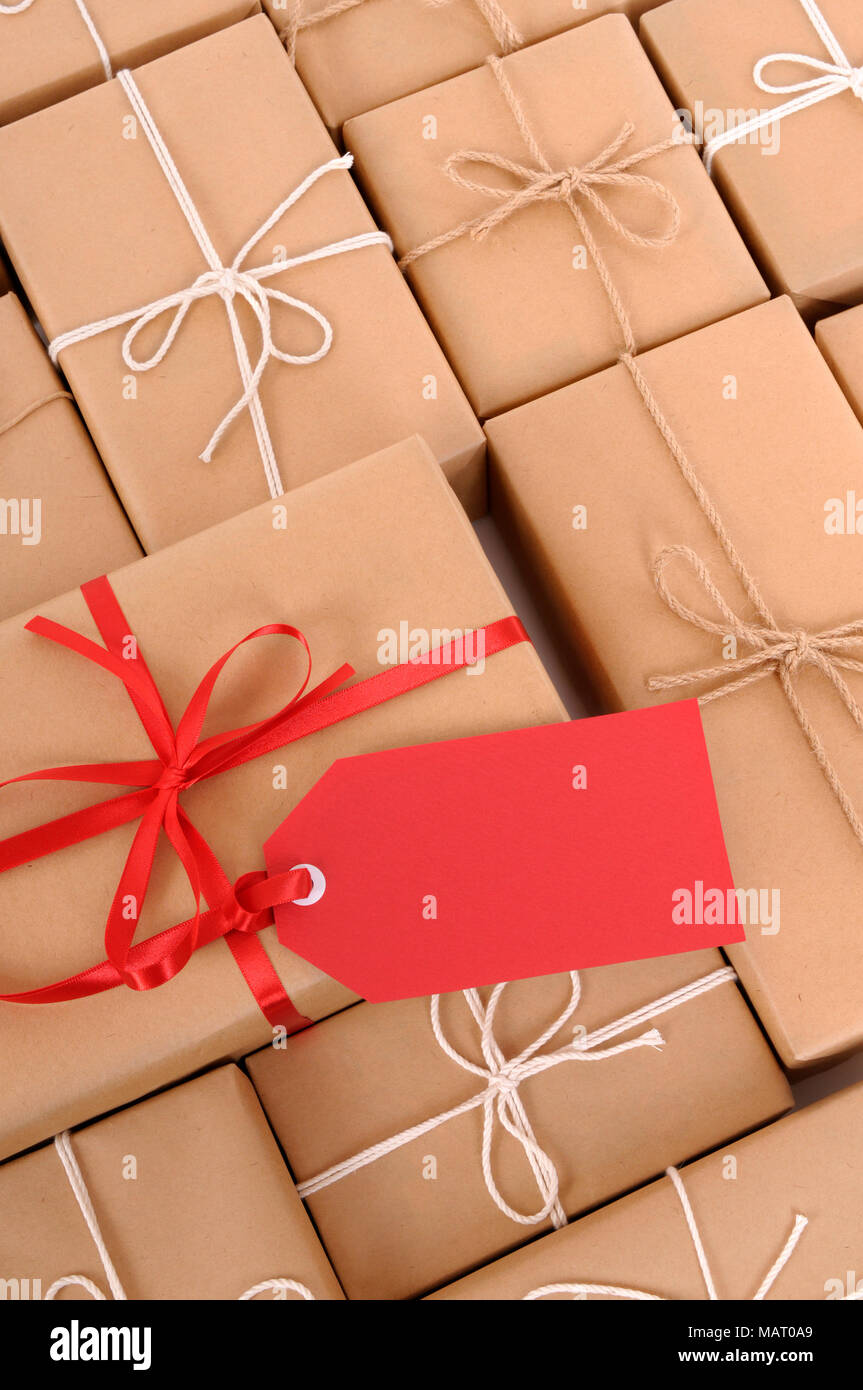 Parcels with red gift tag Stock Photo - Alamy