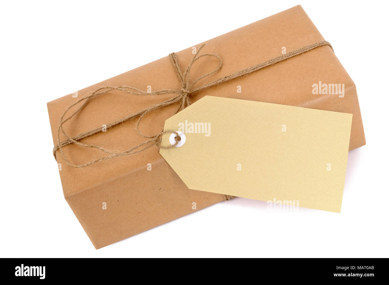 Small brown paper package with label Stock Photo - Alamy