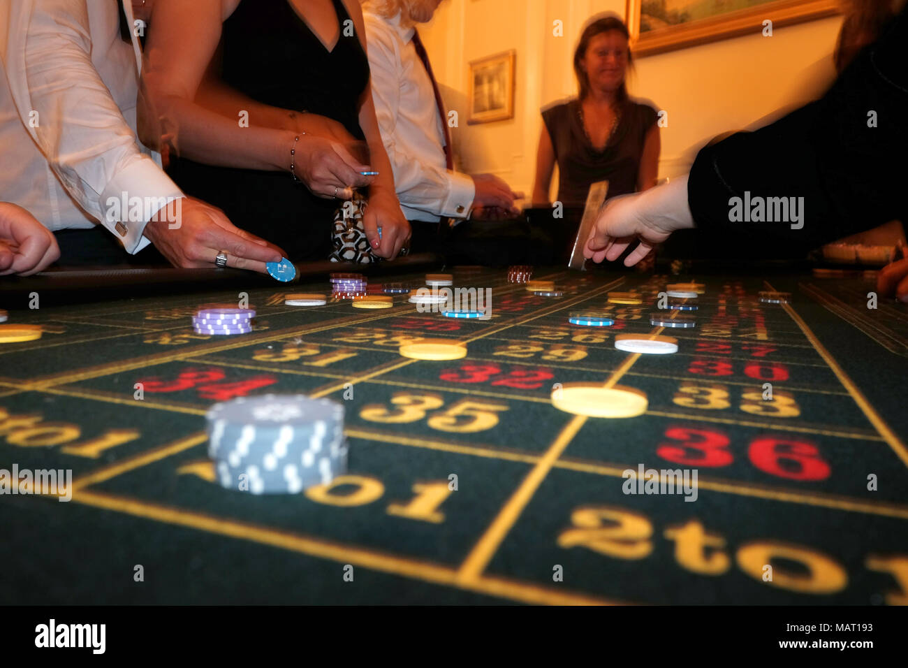 Gamblers gambling for fun at a corporate event Stock Photo - Alamy