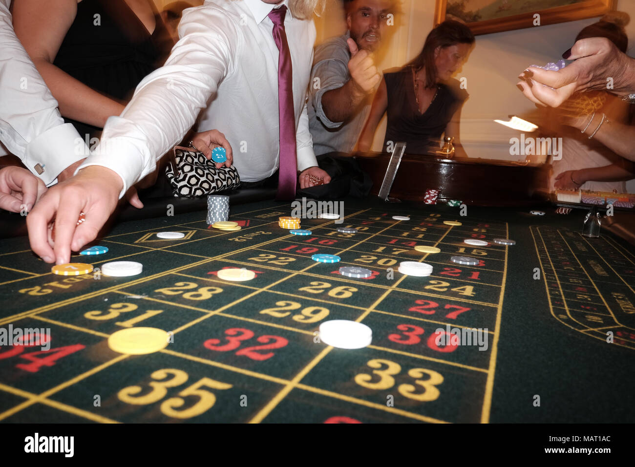 Gamblers gambling for fun at a corporate event Stock Photo - Alamy