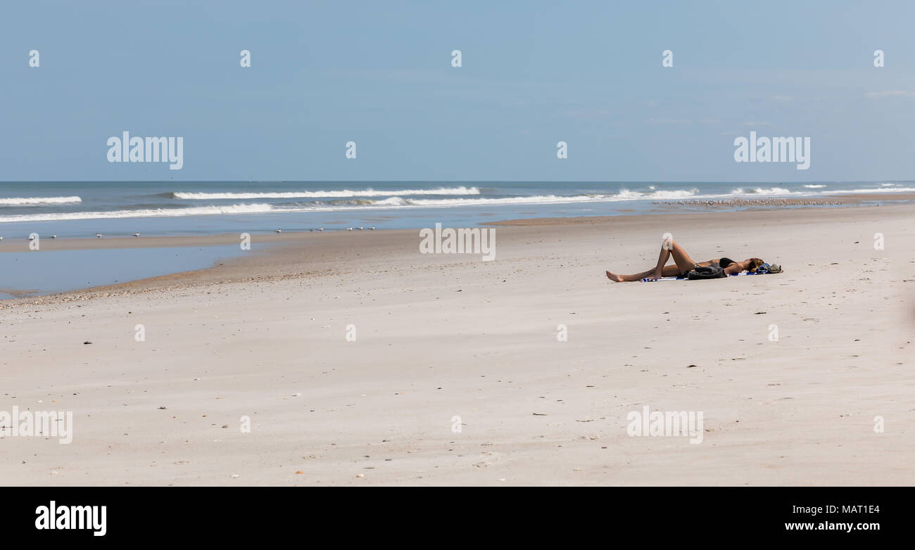 Woman sunbathing bikini alone beach hi-res stock photography and images ...