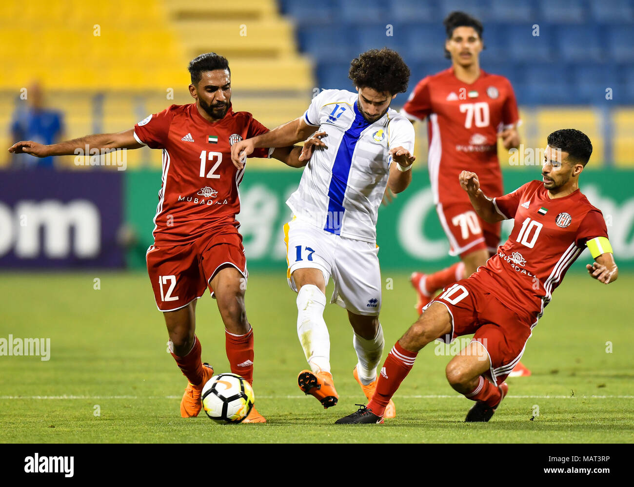 Doha, Qatar. 3rd Apr, 2018. Salim Rashid (L) and Mbark Boussoufa (R) of ...