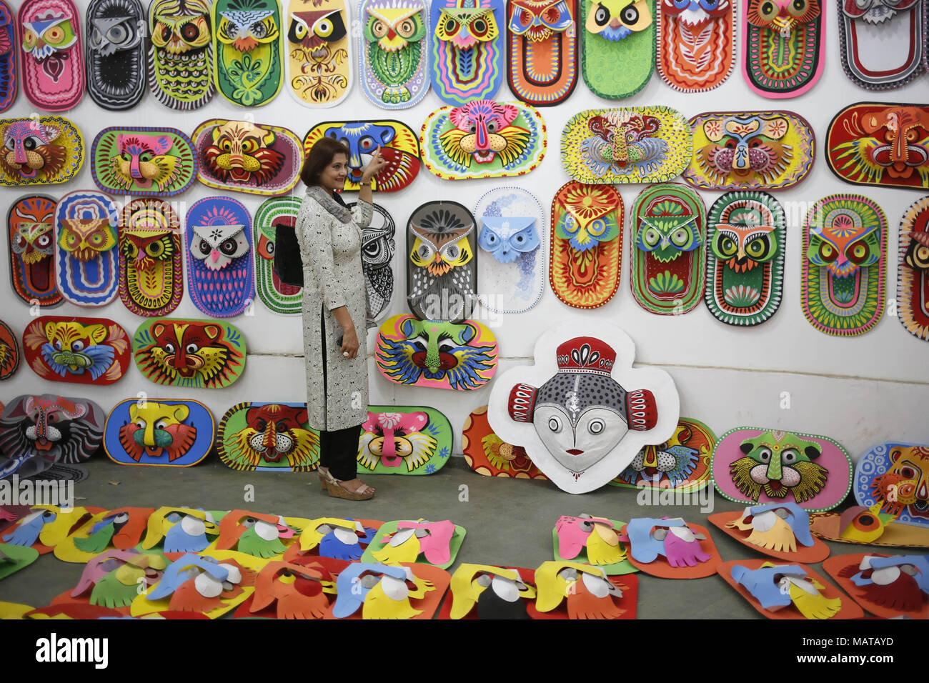 Dhaka, Bangladesh. 4th Apr, 2018. A visitor poses for a photo as paper ...