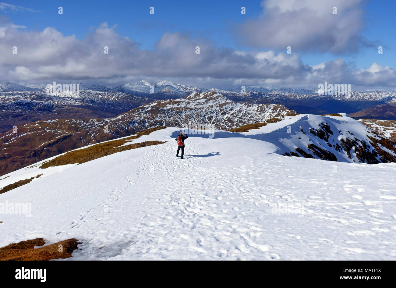 Ben Ledi: Hill walker leaving the summit towards the Stank Glen descent ...