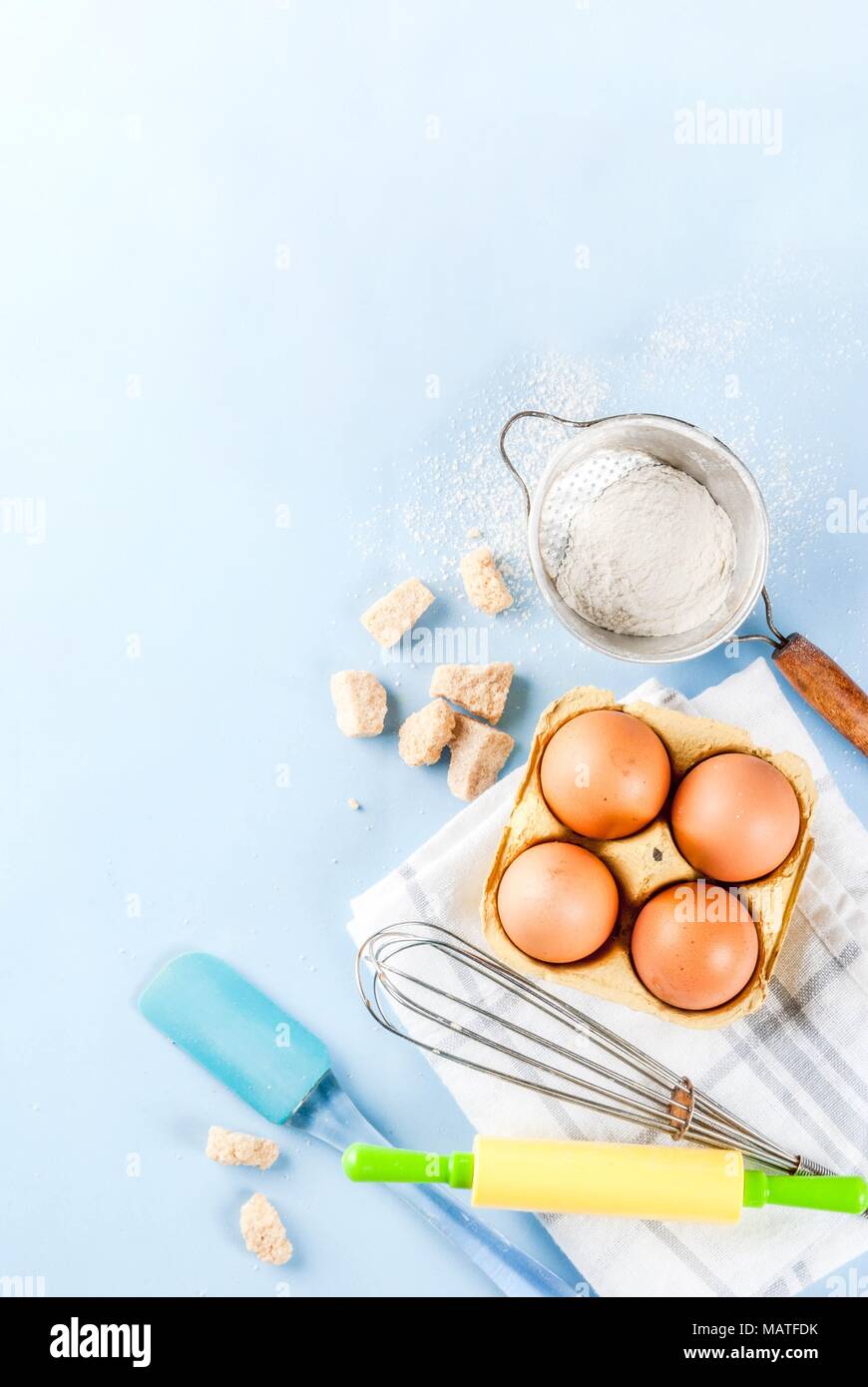 Ingredients and utensils for cooking baking egg, flour, sugar, whisk ...