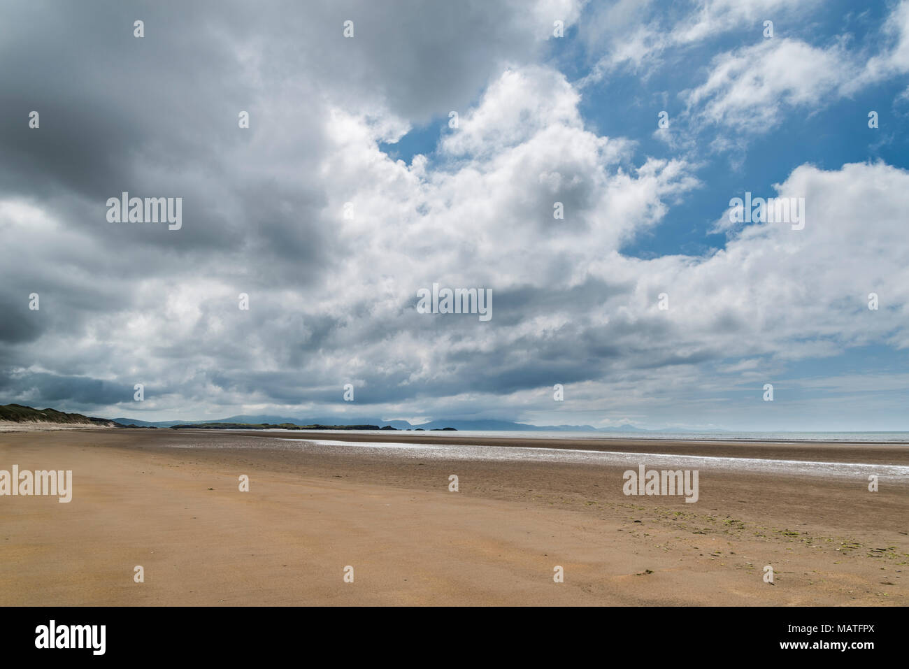 Beach at Malltraeth Bay looking toward Llanddwyn Island on Anglesey ...