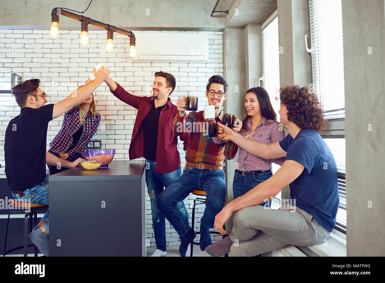 A group of friends at the meeting communicate fun Stock Photo - Alamy