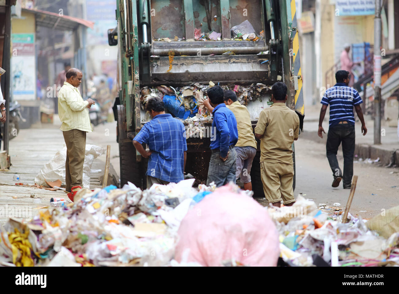 Bangalore, India - October 23, 2016: City garbage collectors dumping ...