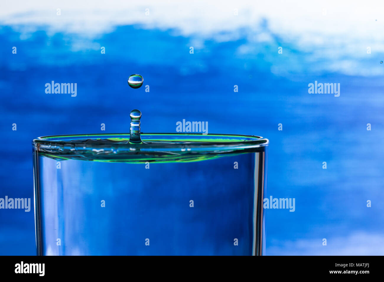 Blue drop water falling glass hi-res stock photography and images - Alamy