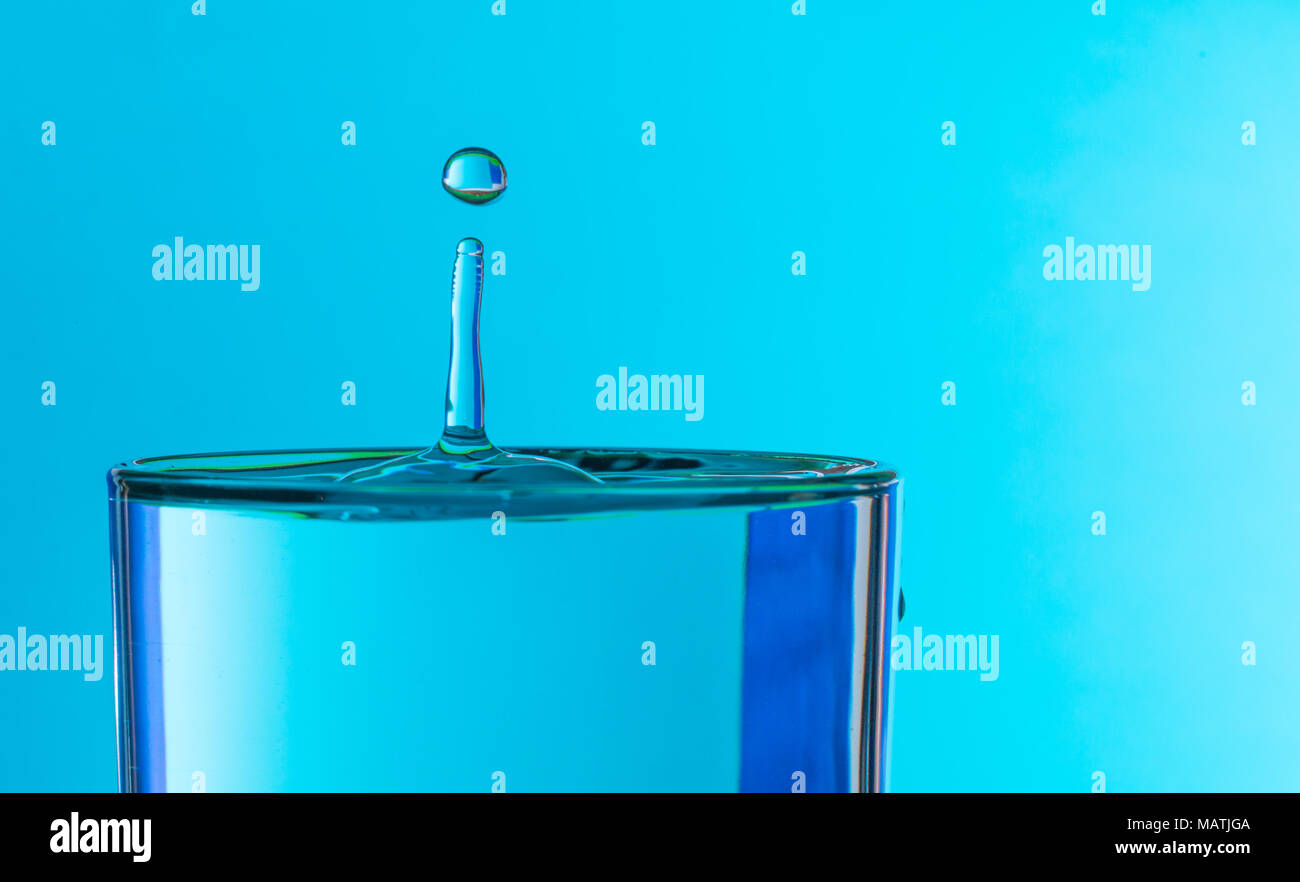 water drop splash in a glass of drinking water Stock Photo - Alamy