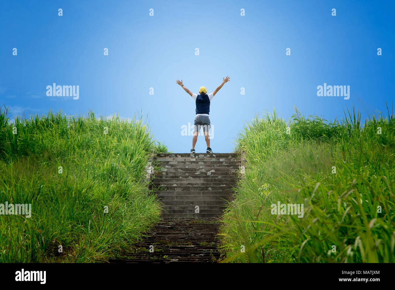 Man celebration success on a top and open arms to the sky, Sport and ...