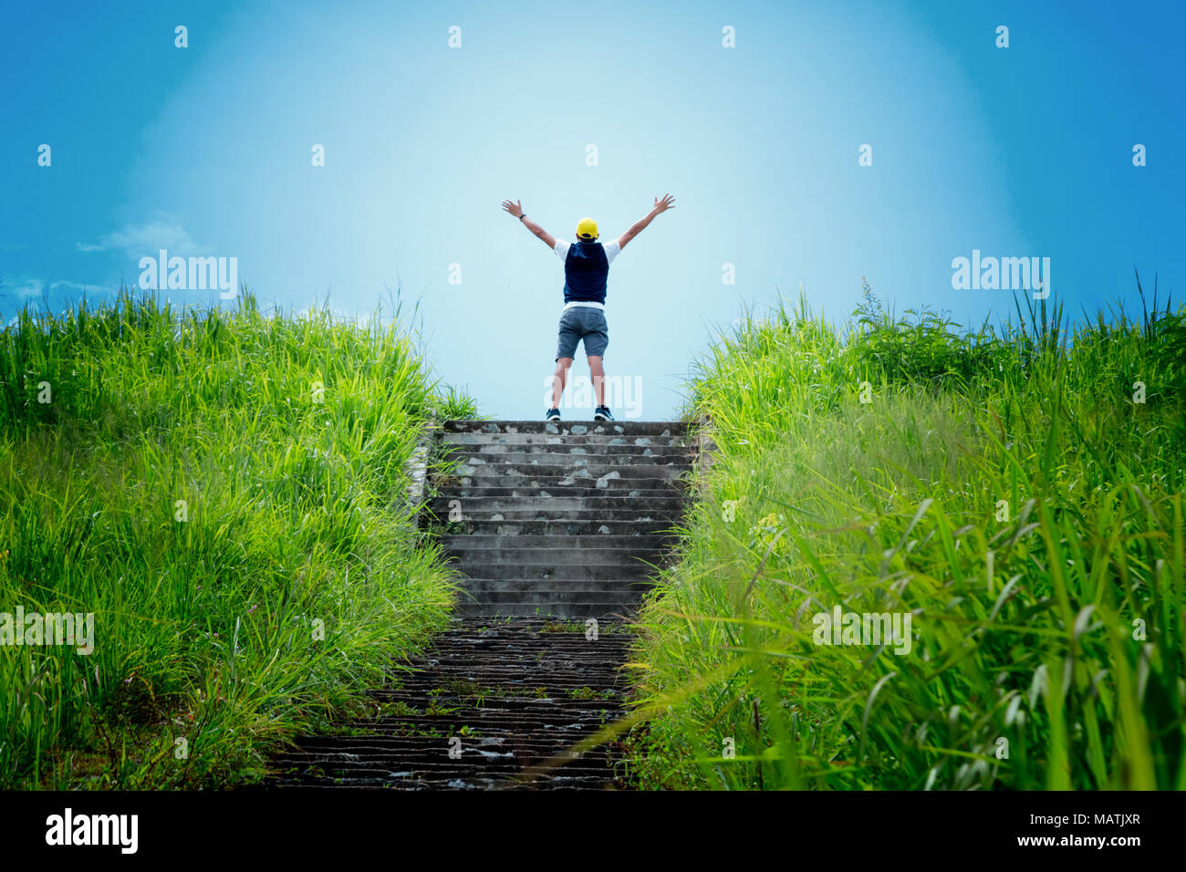 Man celebration success on a top and open arms to the sky, Sport and ...