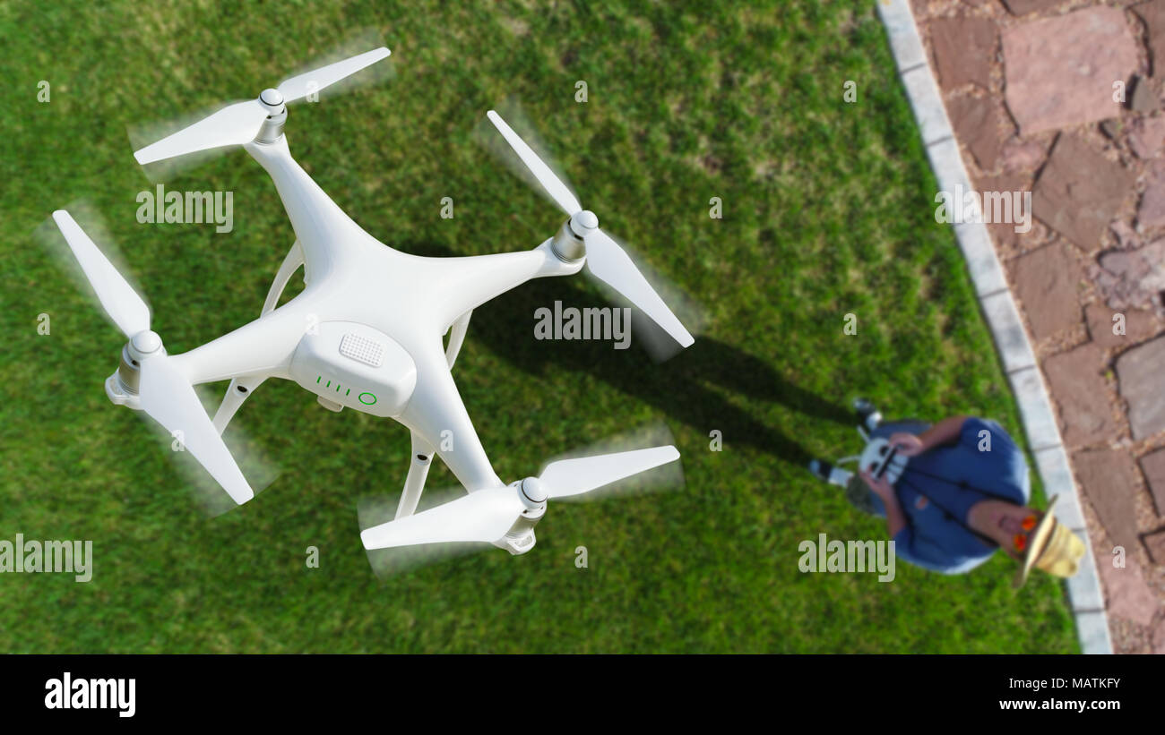 Drone Quadcopter (UAV) In Air Above Pilot With Remote Controller Stock ...