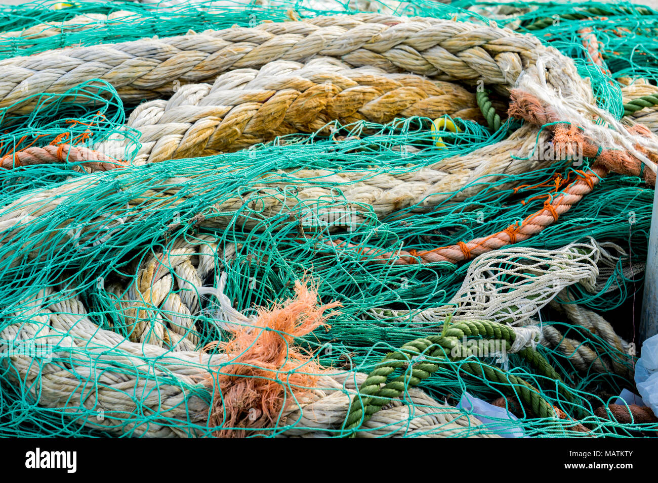 Closeup view at the fishing net on the boat Stock Photo - Alamy