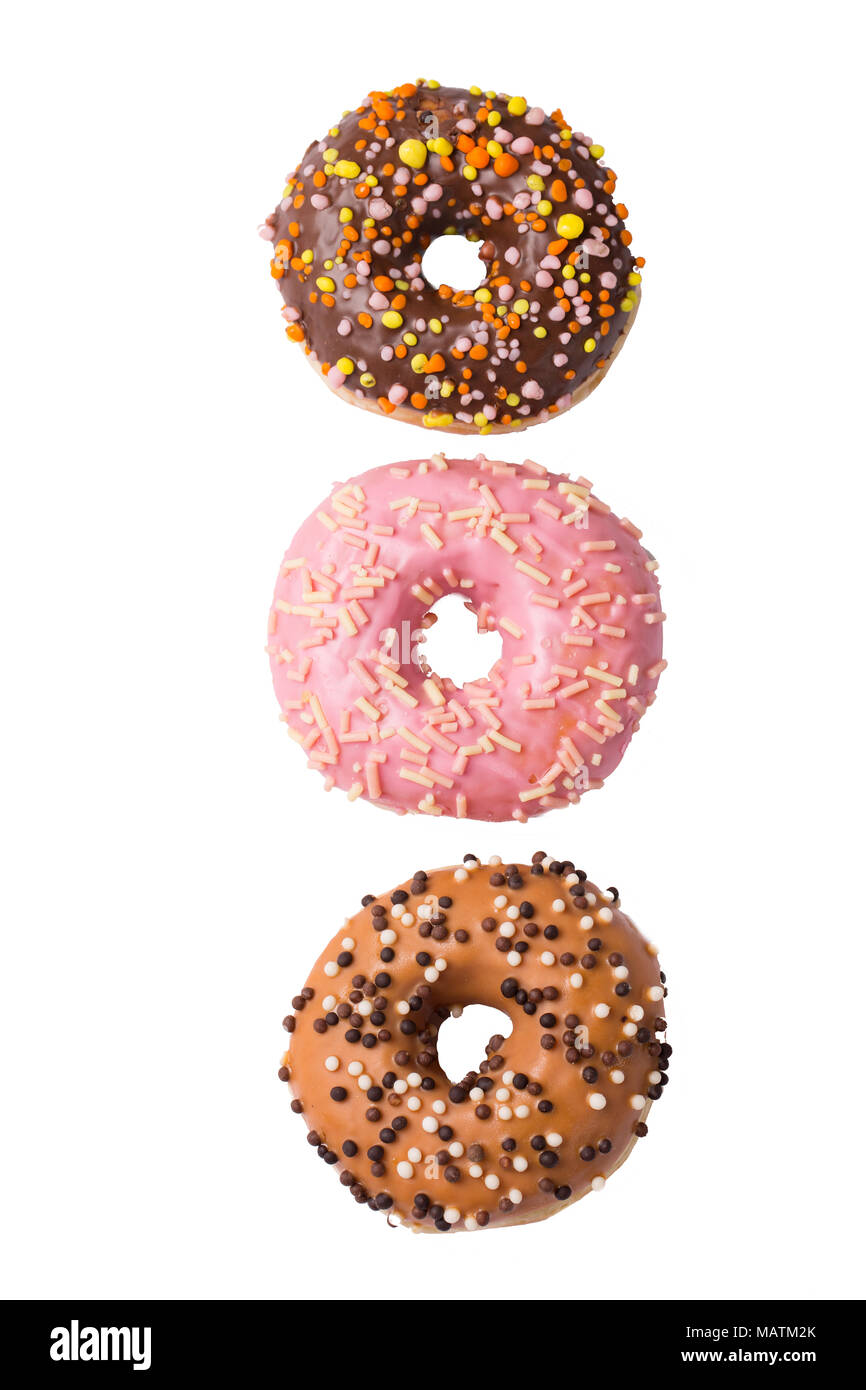 Three colorful glazed donuts isolated on white background, top view ...