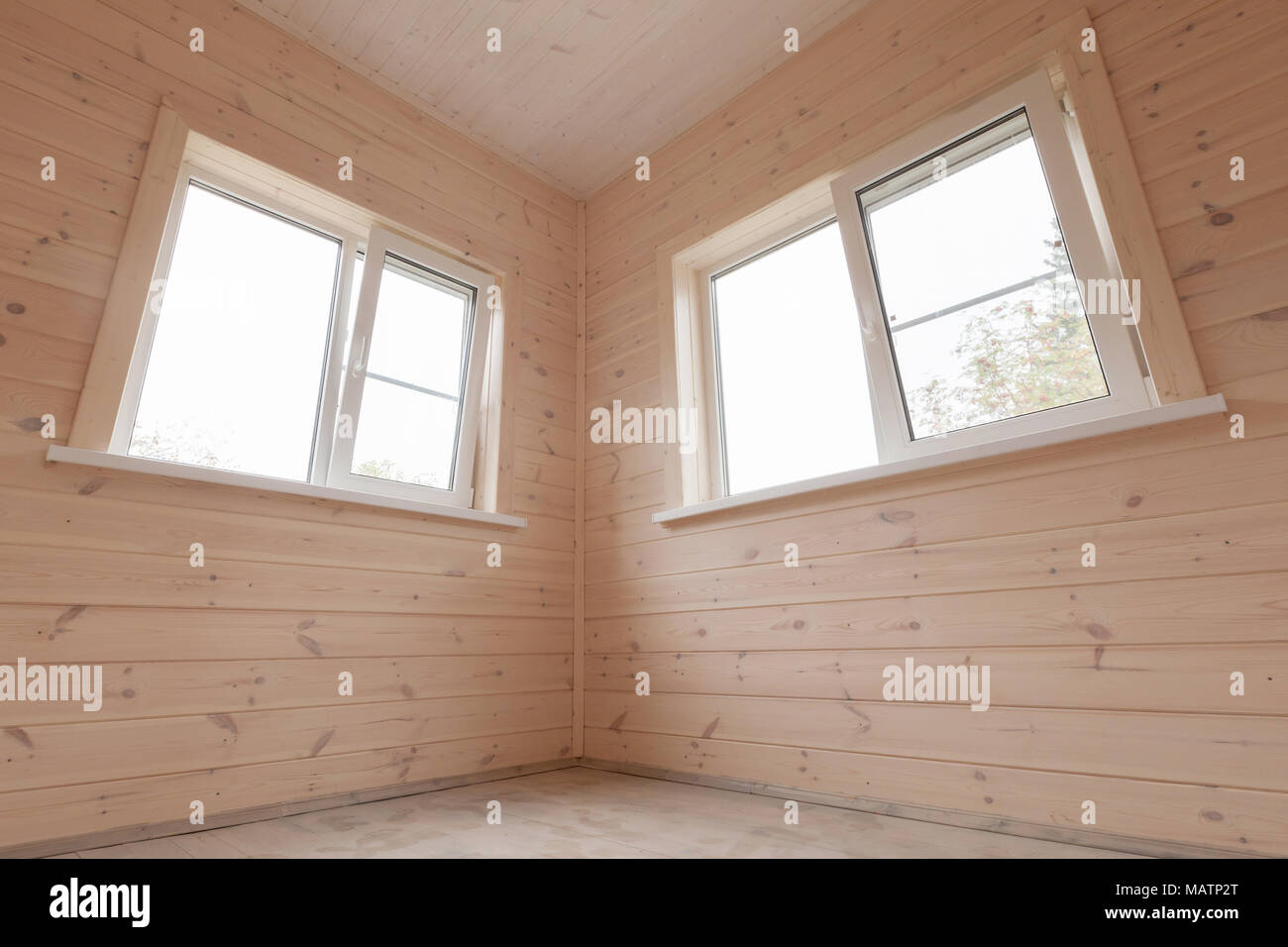 Empty wooden house interior, walls and two bright windows Stock Photo ...