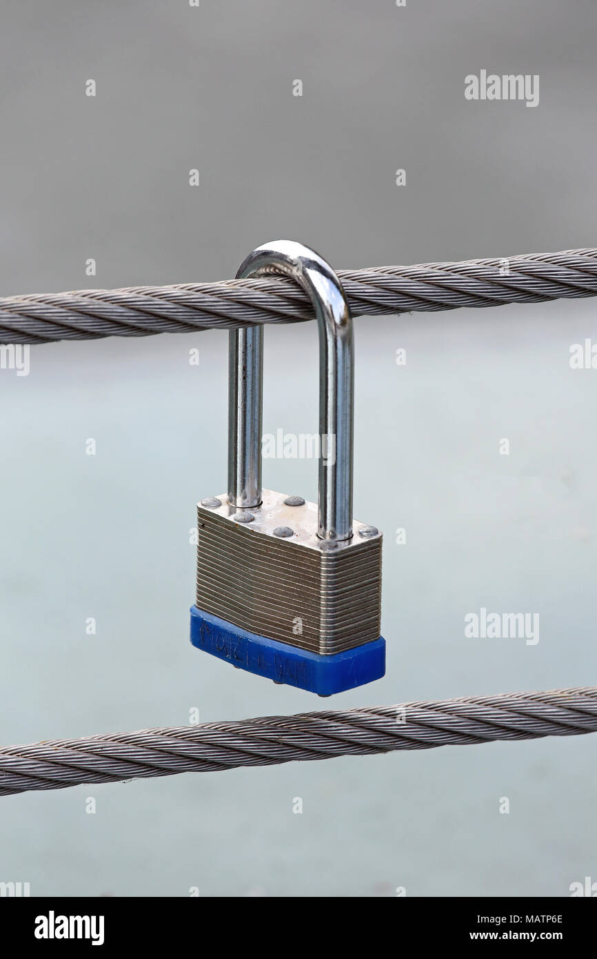 Long Stainless Steel Padlock Locked at Cable Stock Photo - Alamy