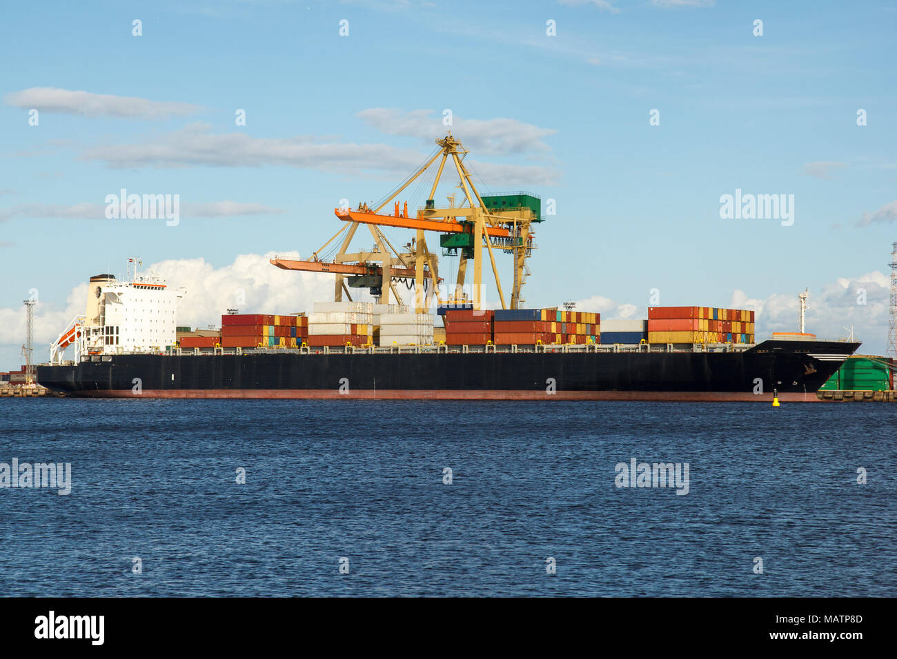 the container vessel in the port is loaded with containers Stock Photo ...