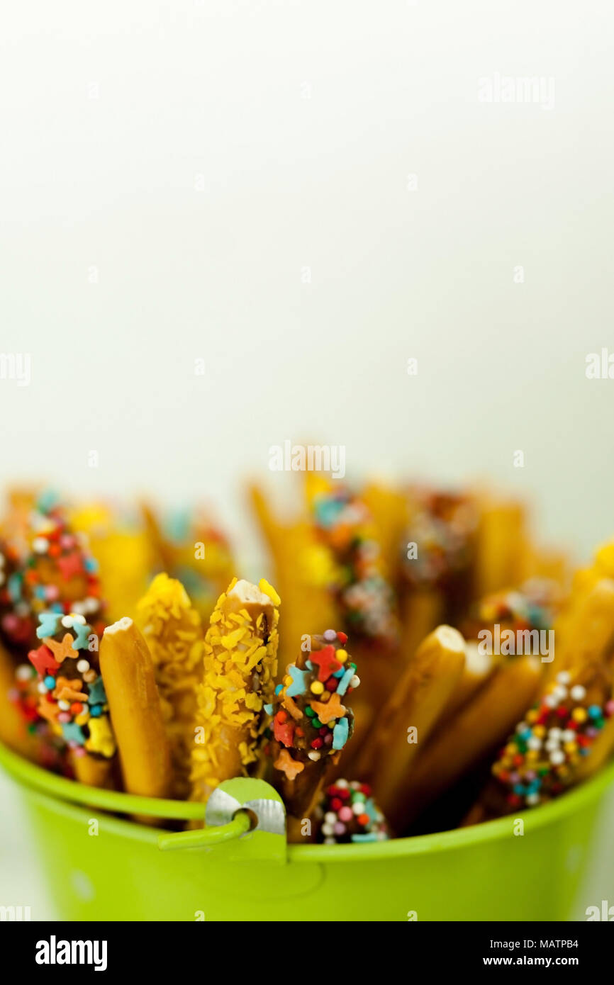 green bucket with sweets Stock Photo - Alamy