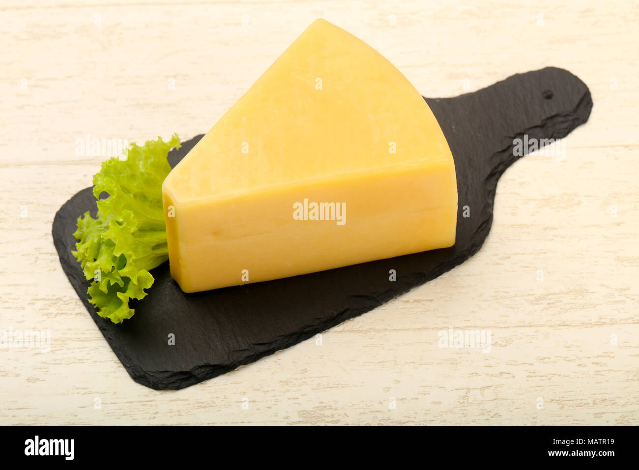 Parmesan cheese triangle Stock Photo - Alamy