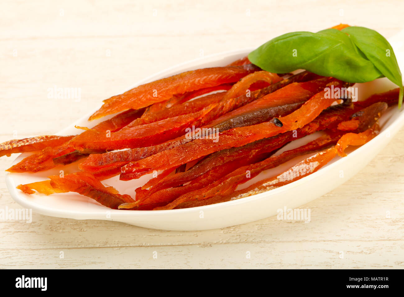 Salmon dry sticks snack Stock Photo - Alamy