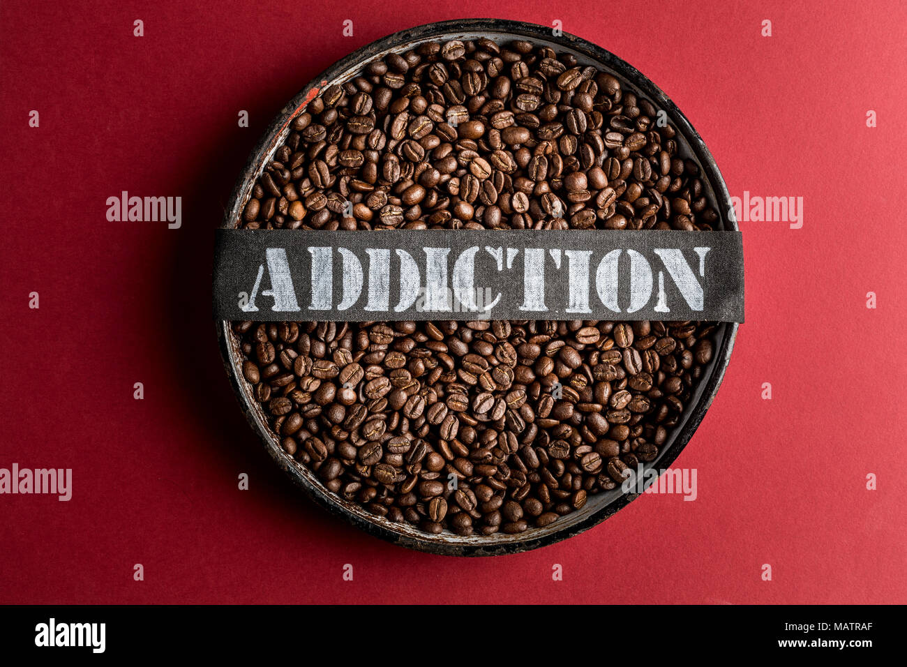 Coffee addiction on red background Stock Photo - Alamy
