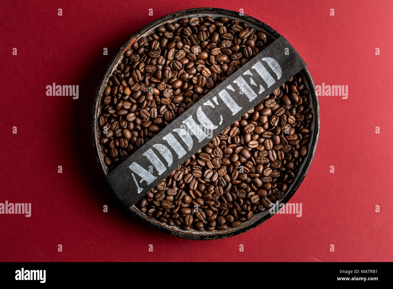 Coffee addicted on red background Stock Photo - Alamy