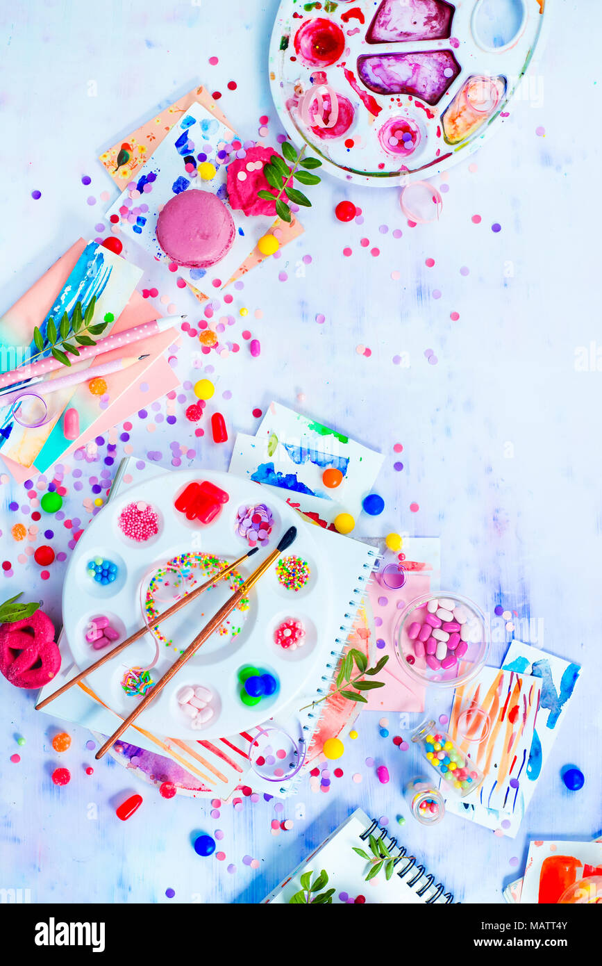 Colorful party activity concept with artist tools, brushes and palette ...
