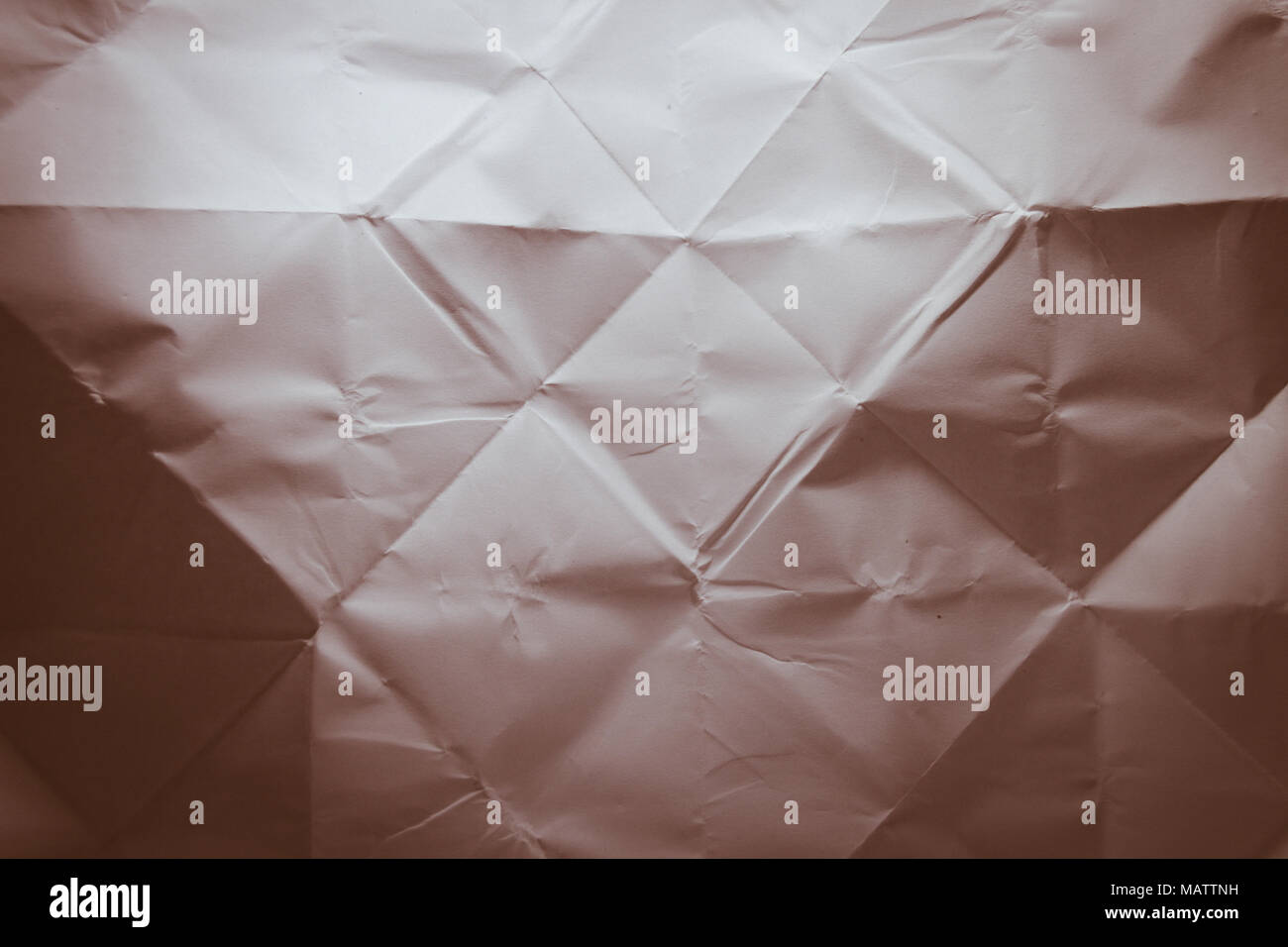 Photograph of a folded paper background or texture Stock Photo - Alamy