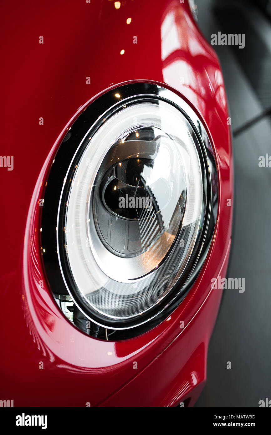 Modern back of red sport car mini cooper s with reflection on left side ...