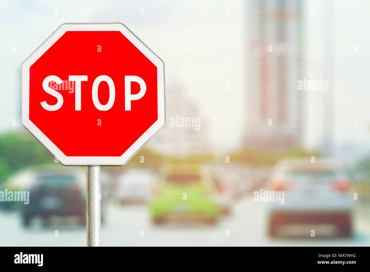 Stop sign by the City road Stock Photo - Alamy