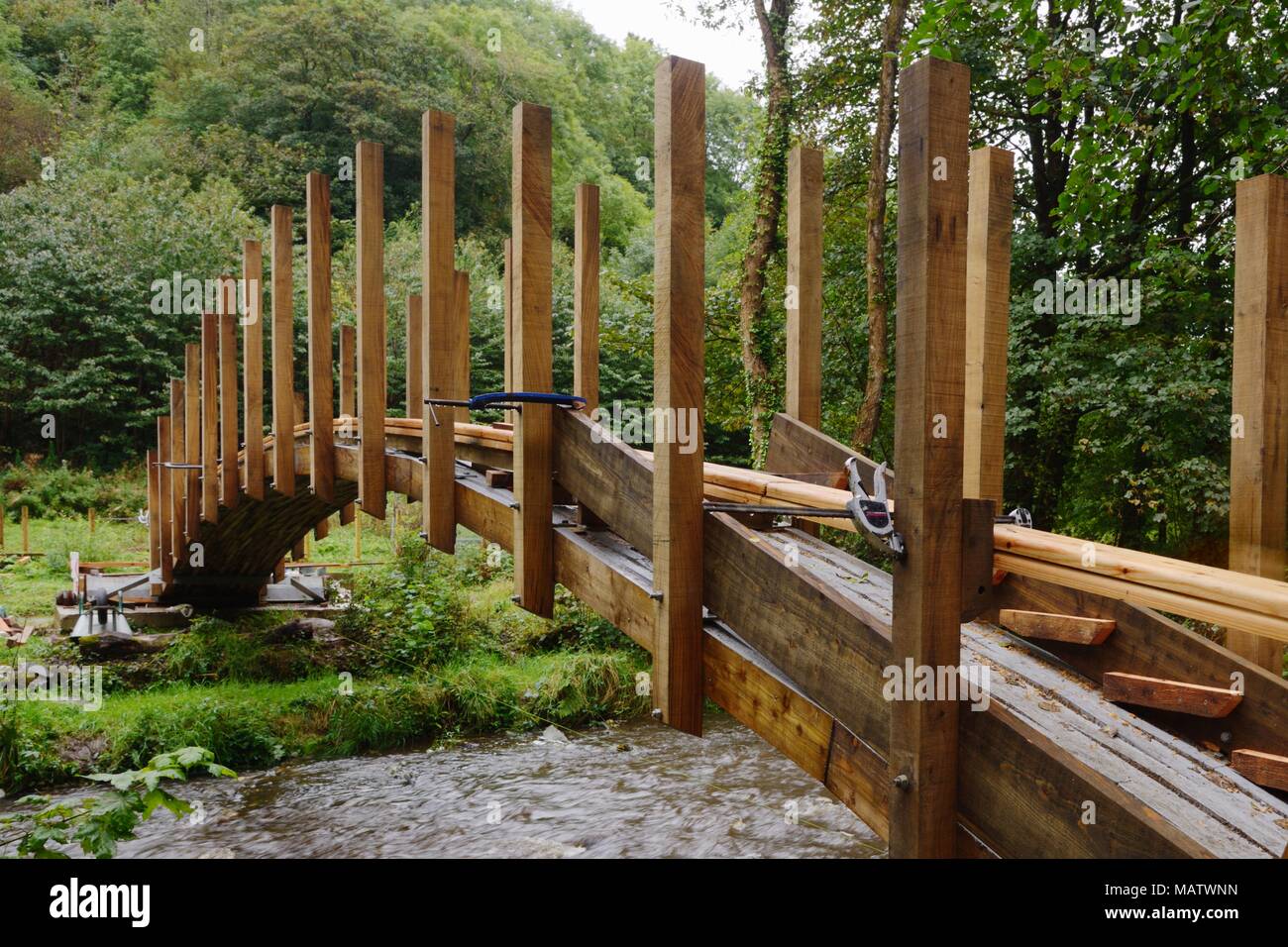 14 in a series of 32, building a timber footbridge. Posts installed ...