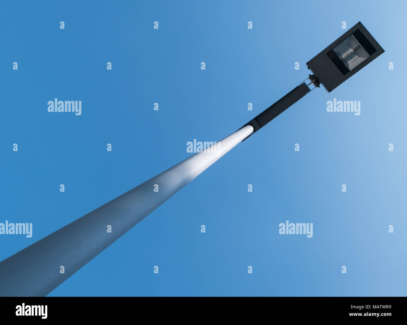 Rectangular and modern street light with blue sky as background. Bottom ...