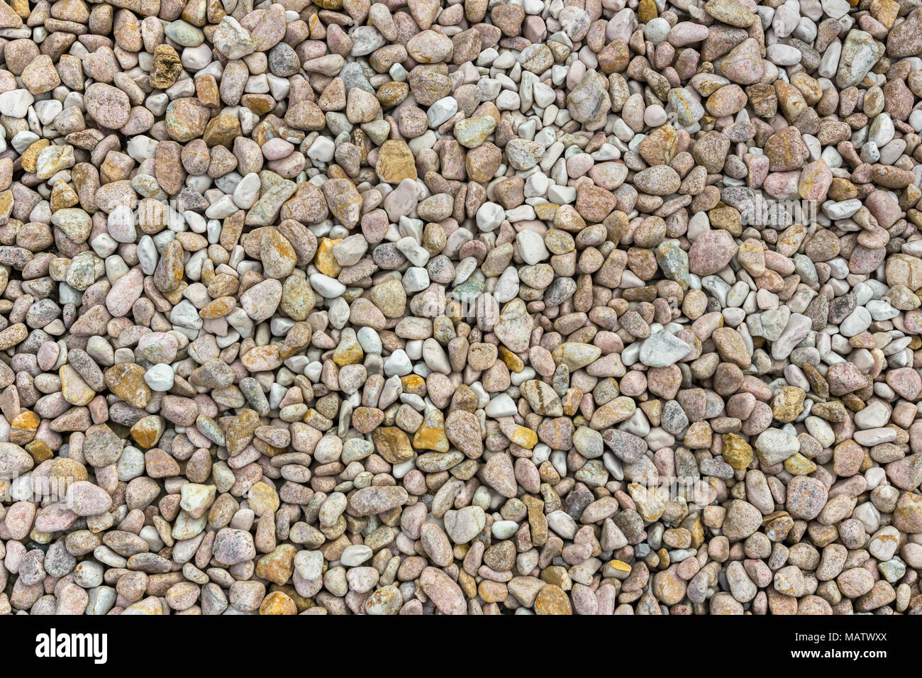 Abstract small stone background, texture stone. Pile of pastel colored ...