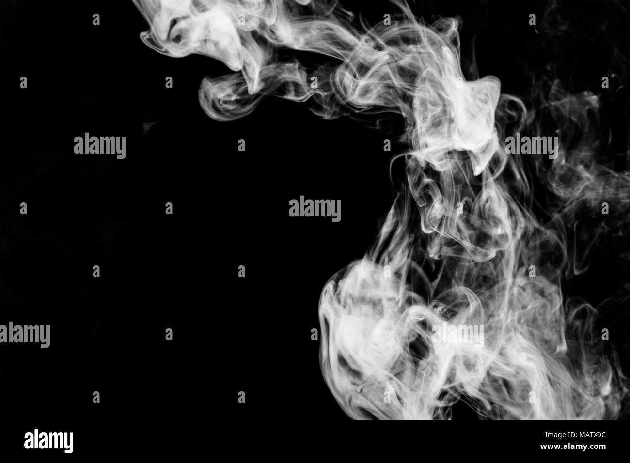 Thick white smoke on a black isolated background. Background from the ...