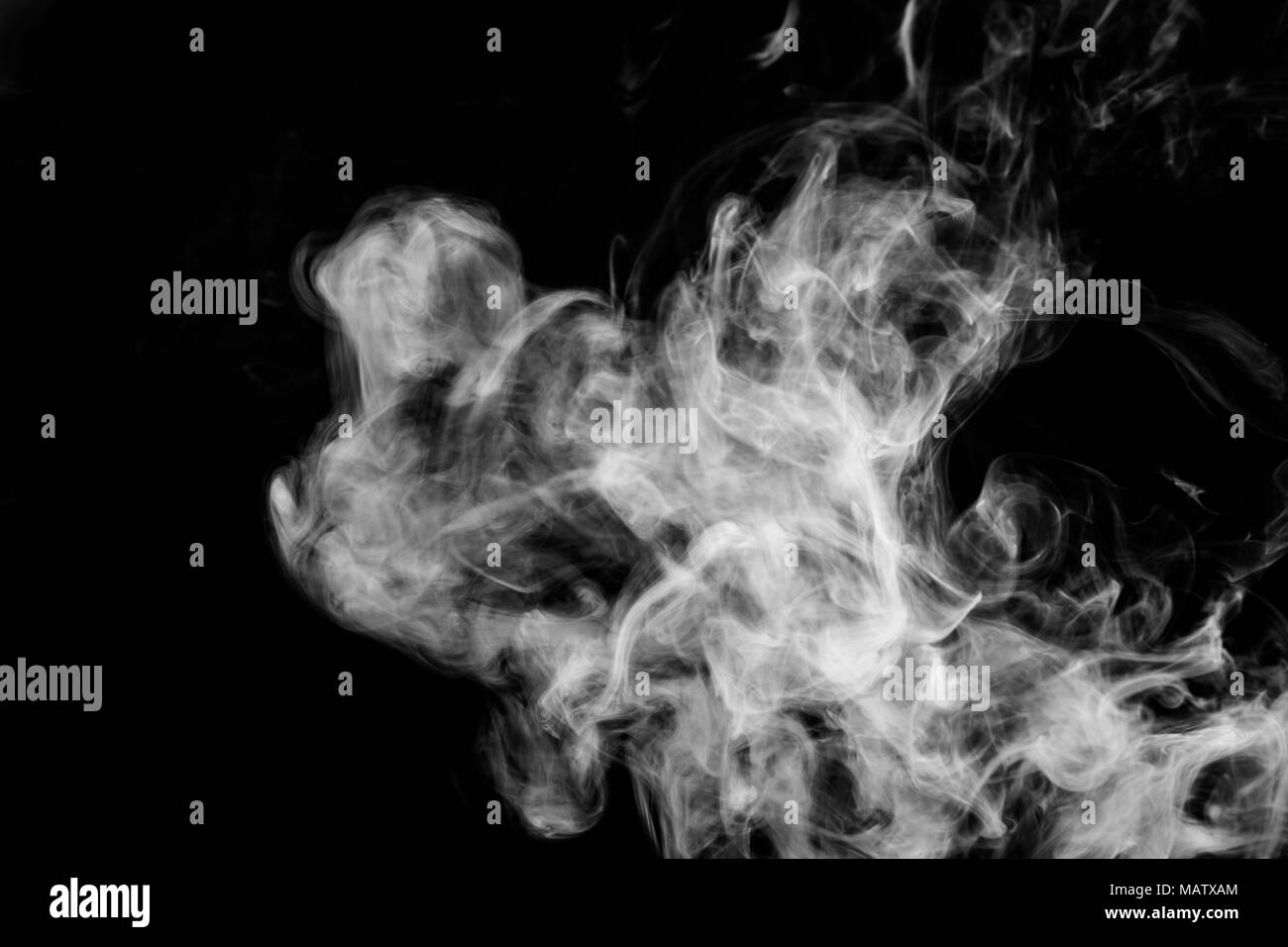 Thick white smoke on a black isolated background. Background from the ...