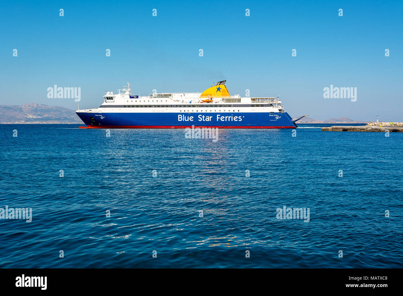 NAXOS, GREECE - May 23, 2017: Blue Star Ferry boat leaving the port of ...