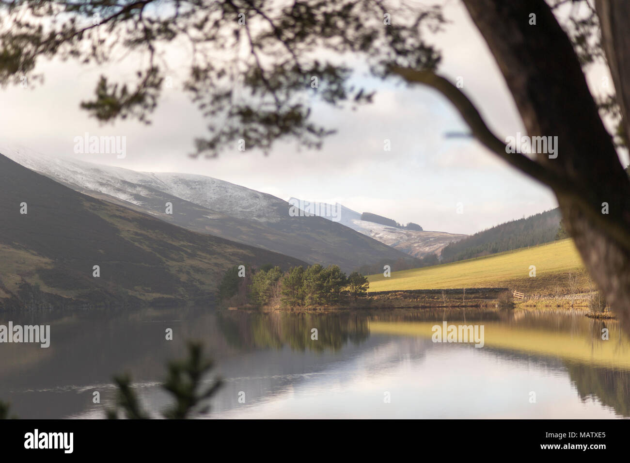 Flotterstone water reservoir near Edinburgh surrounded by the snowy ...