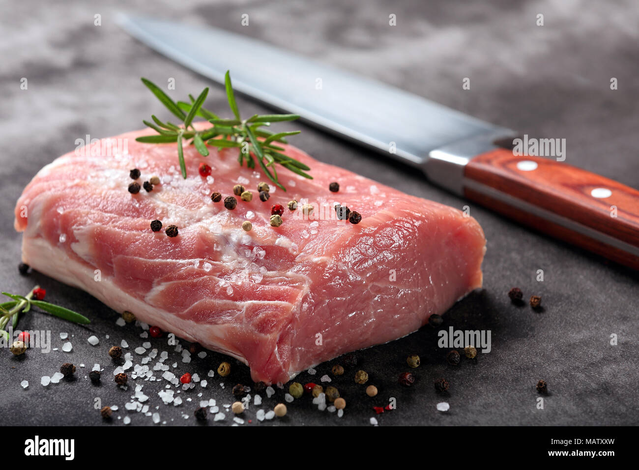 Raw pork loin with spices Stock Photo - Alamy