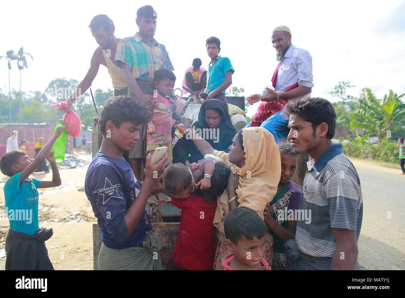 Myanmar's Muslim Rohingya minority takes ride on a vehicle after ...
