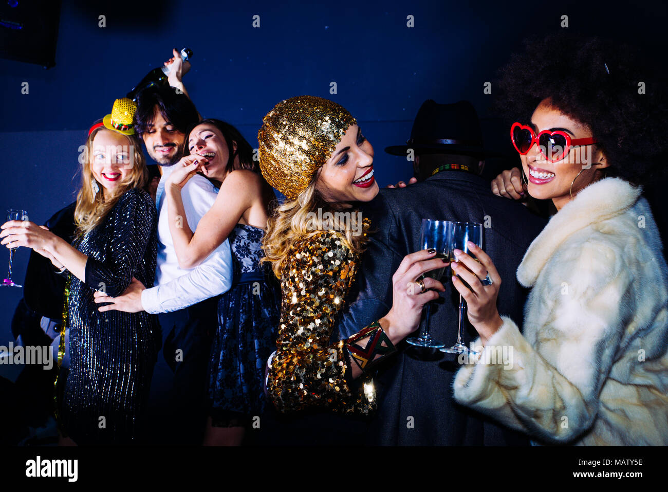 Party people celebrating in the club Stock Photo - Alamy
