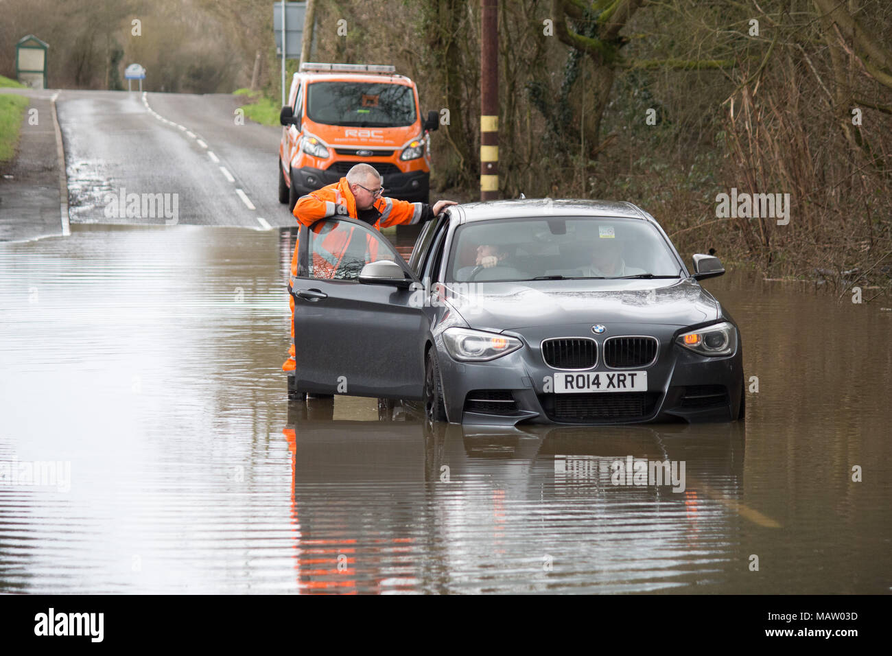 A car is stranded in flooded water from the River Anker on the ...