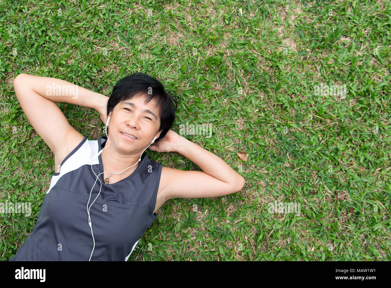 Woman lying outdoor grass hi-res stock photography and images - Alamy