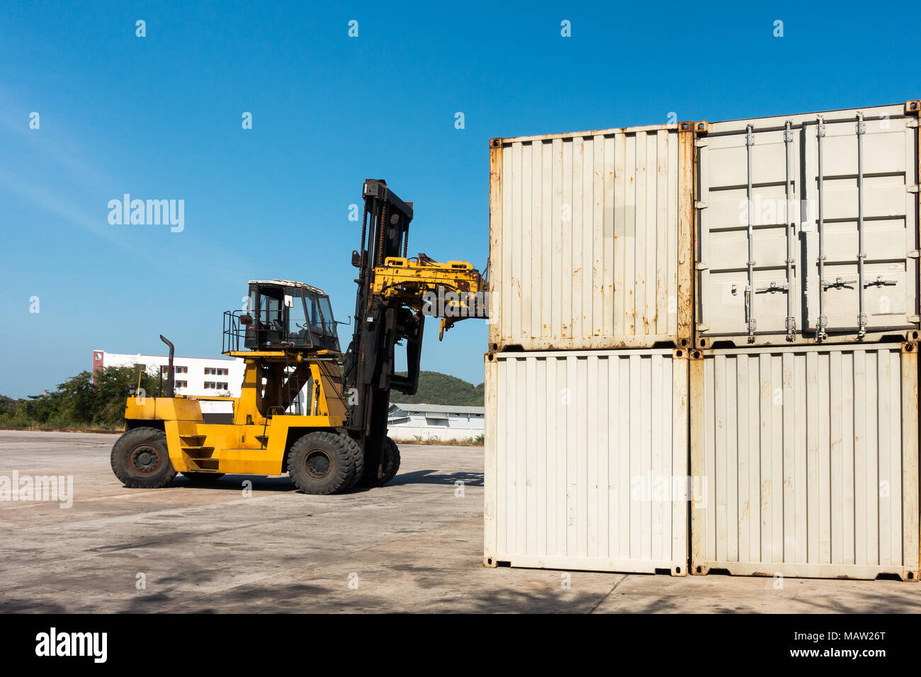 Container unloading truck in logistics yard Stock Photo - Alamy