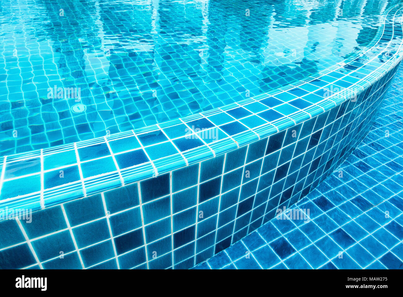 Ceramic tile of swimming pool with water reflection Stock Photo - Alamy