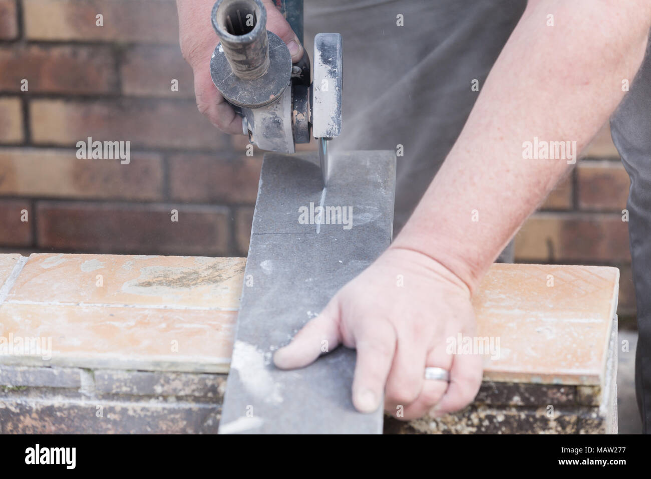 Professional tiler cutting tile angle hi-res stock photography and ...