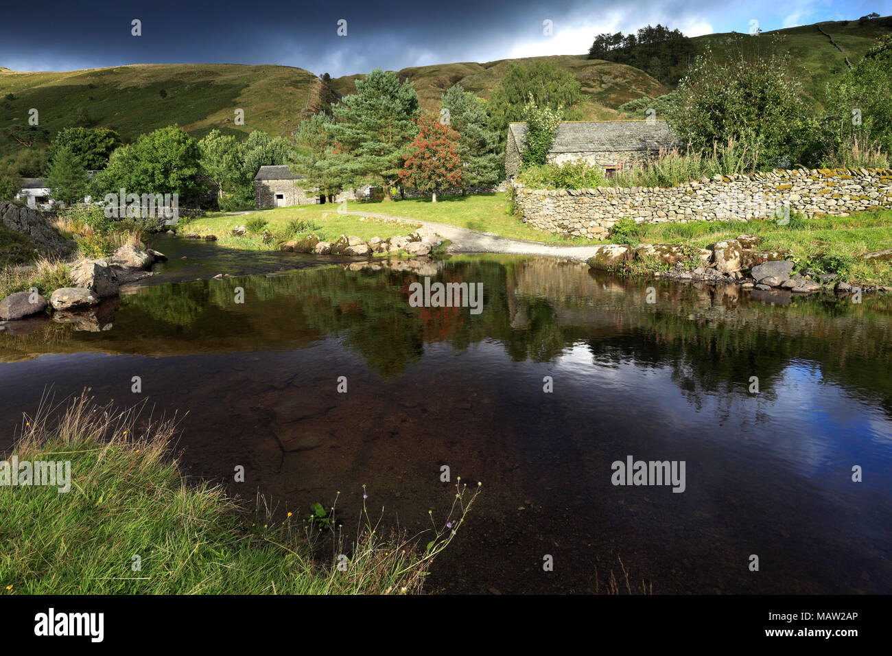 Summer view over Watendlath Tarn farm, Lake District National Park ...