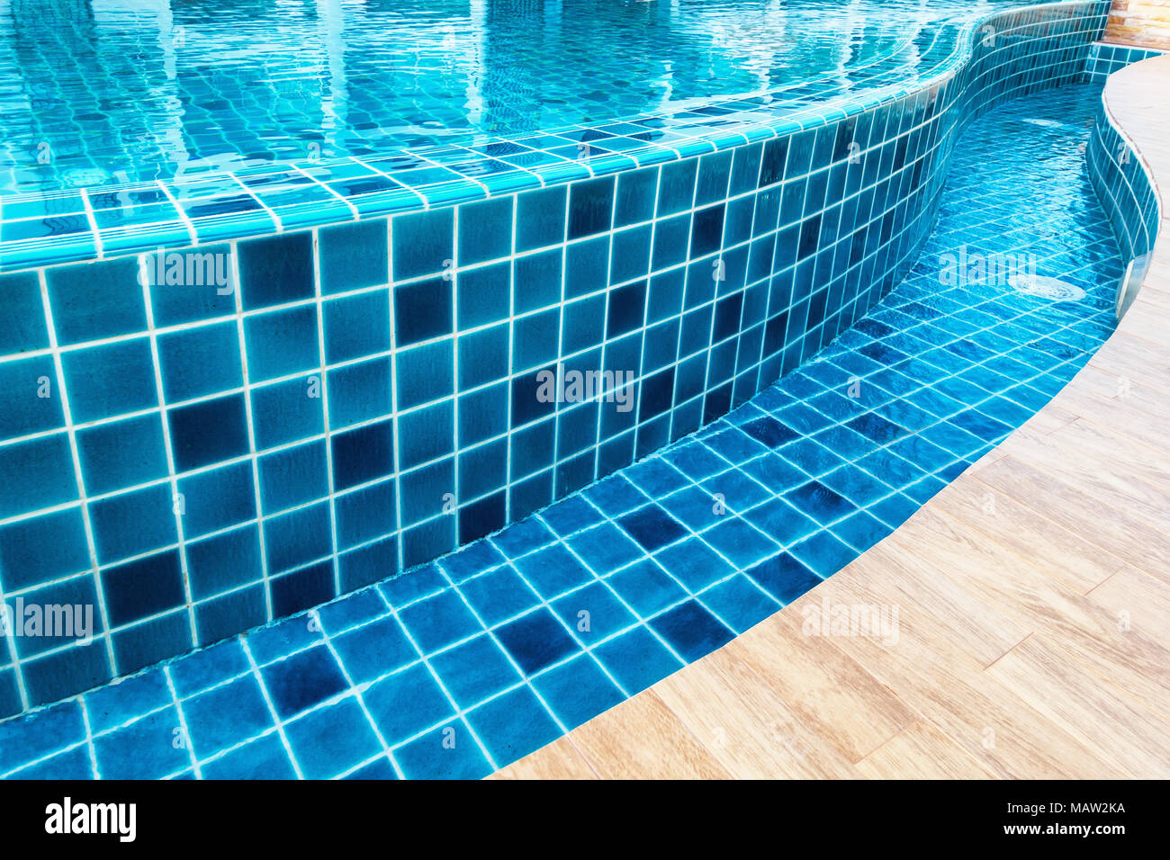 Ceramic tile of swimming pool with water reflection Stock Photo - Alamy