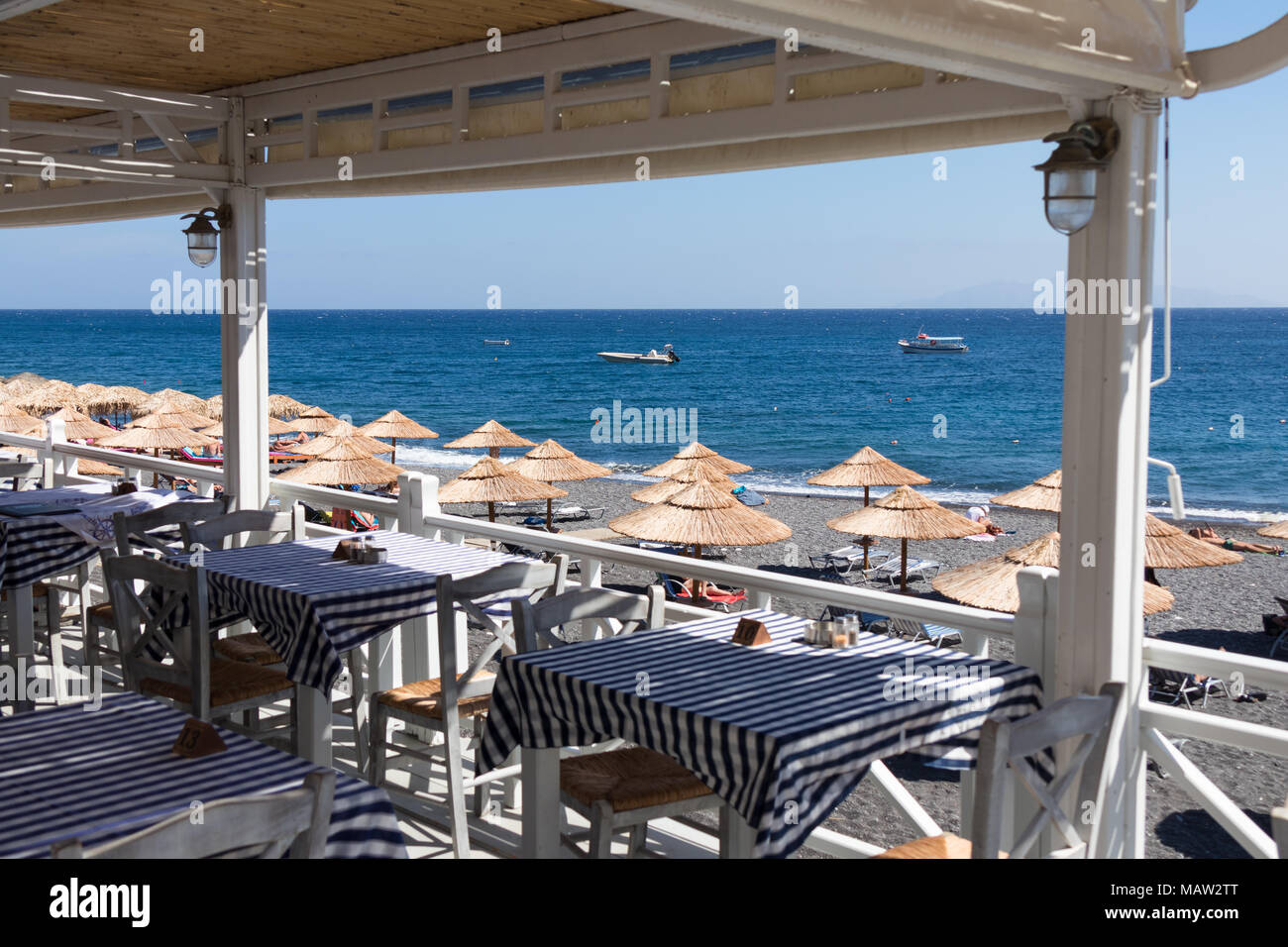 restaurant terrace in front of the beach in kamari on the island of ...
